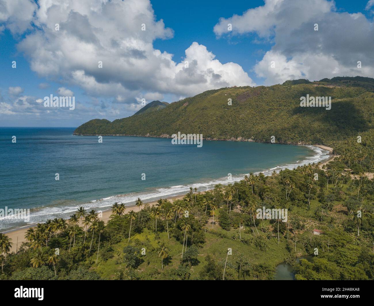 Landscape of El Valle Beach surrounded by greenery and sea in Samana ...