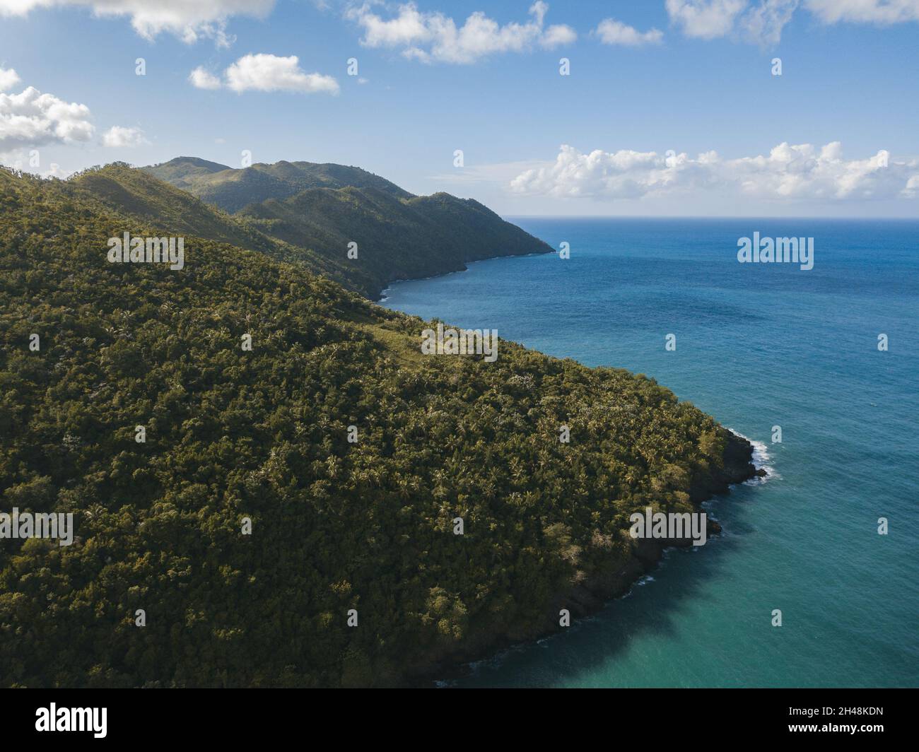 Landscape of El Valle Beach surrounded by greenery and sea in Samana ...