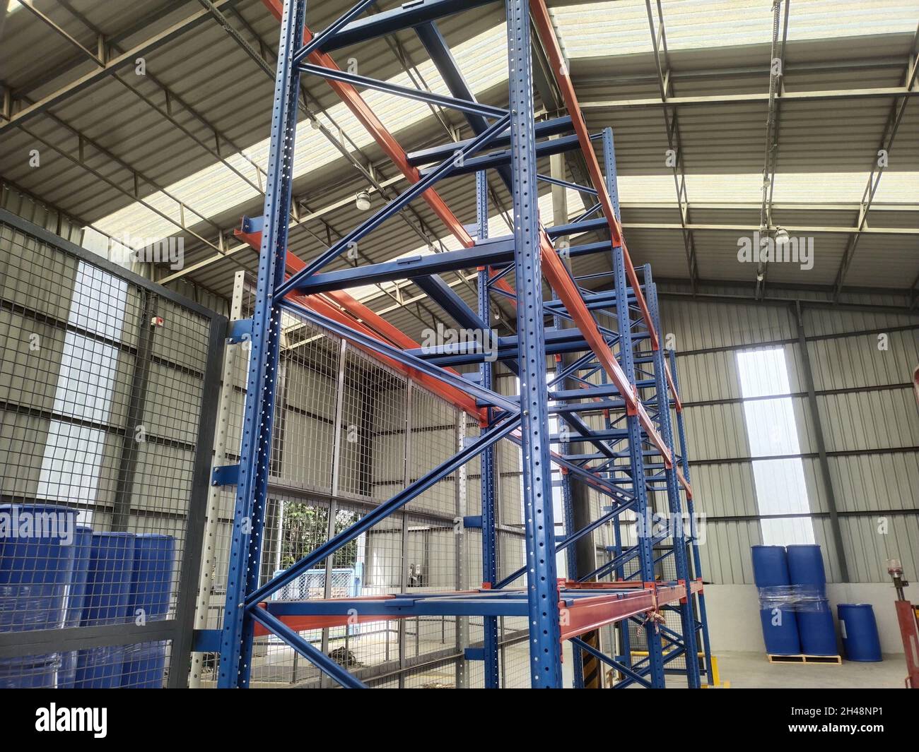 Close-up shot of empty blue storage pallet racks for storing goods in ...