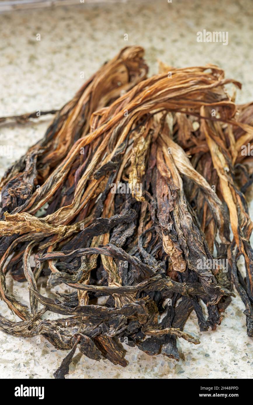 Close-up of a handful of dried vegetables on the table, Guangdong ...