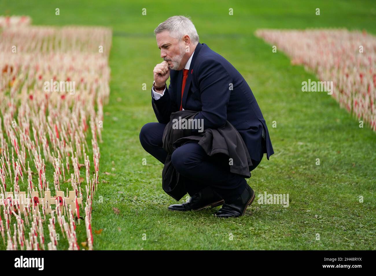 A man observes the planted tributes during the official opening of the ...