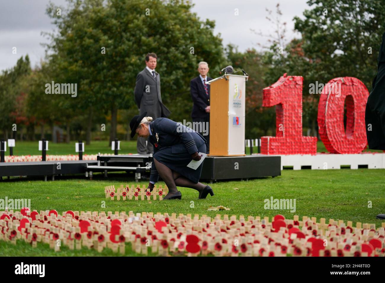 Members of the military plant their own tributes during the official ...