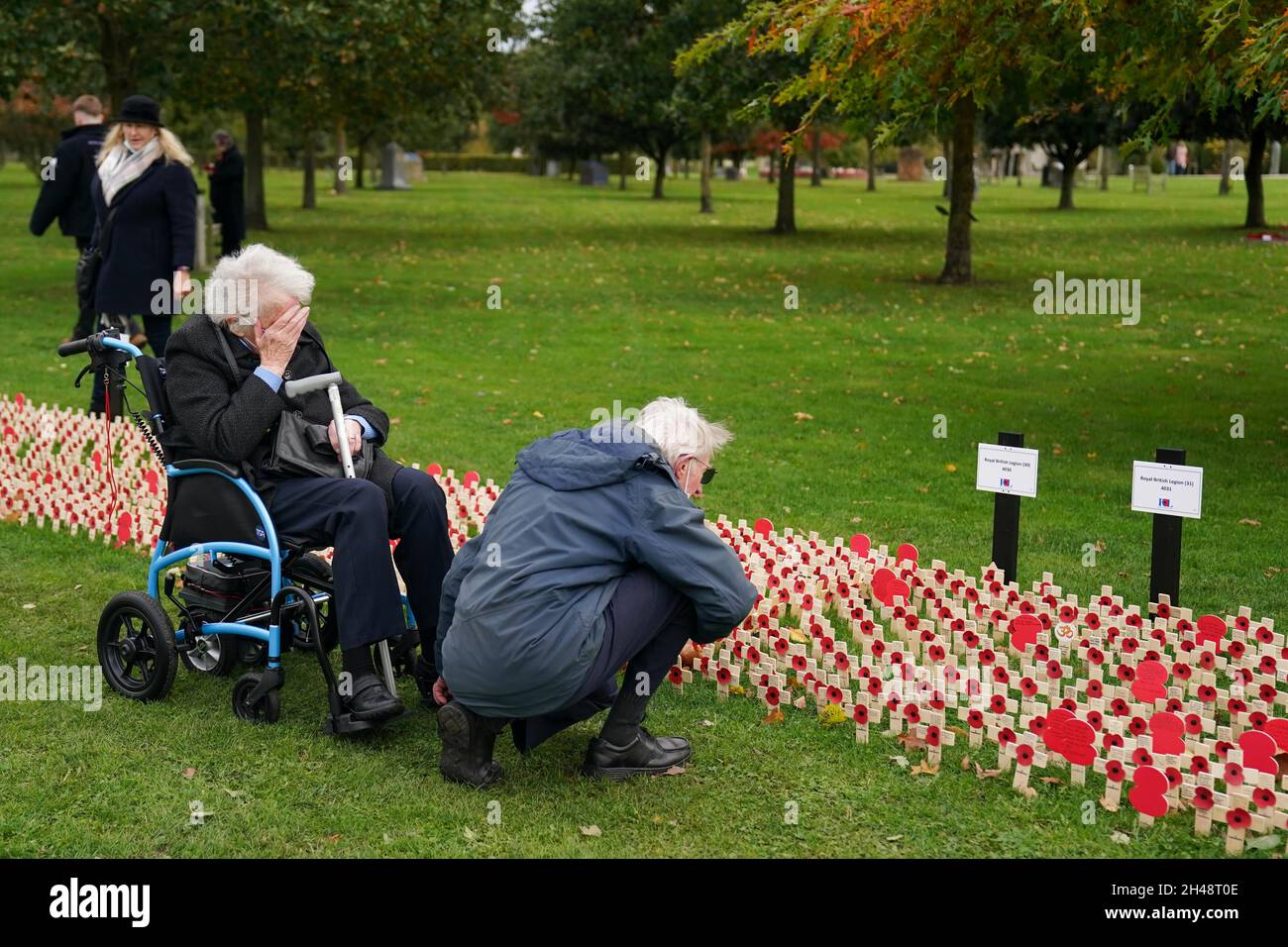 People observe the planted tributes during the official opening of the ...