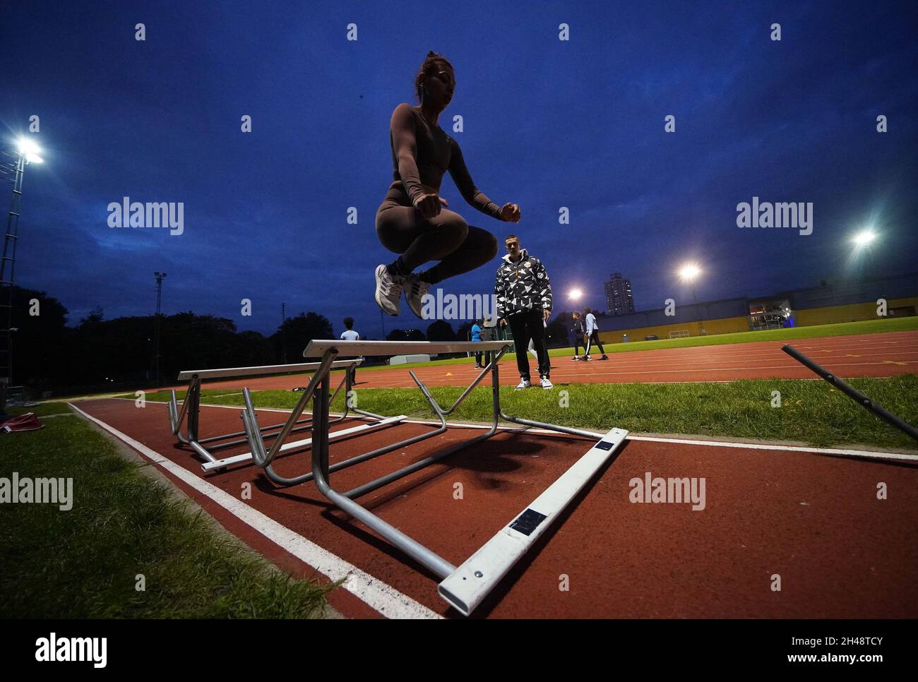 British professional boxer Ruqsana Begum jumping hurdles during a ...