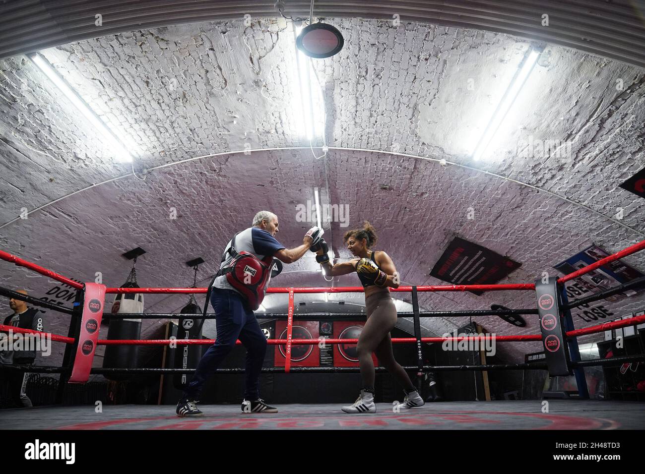 British professional boxer Ruqsana Begum doing pad work - to sharpen up ...