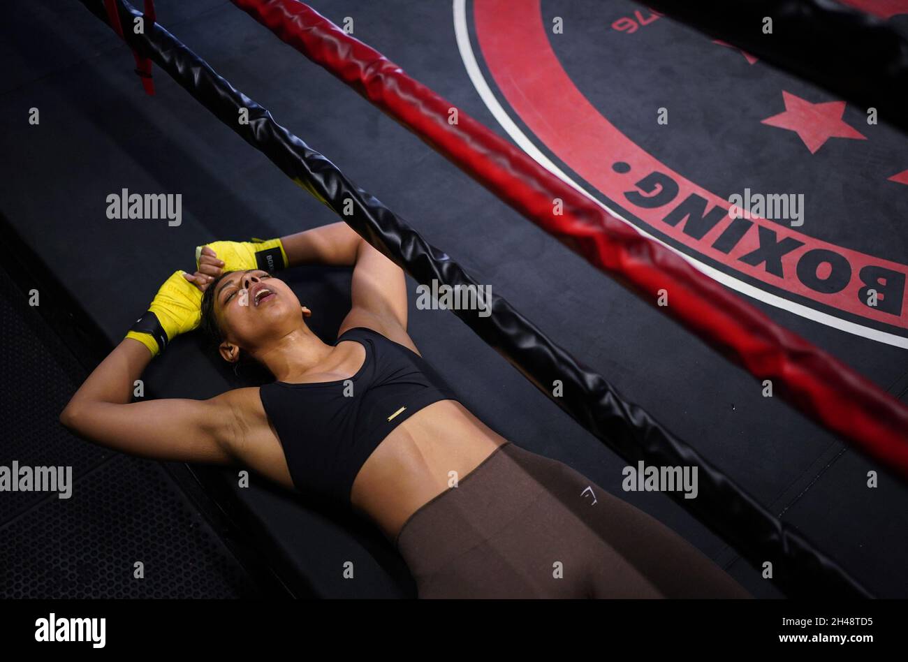 British professional boxer Ruqsana Begum takes a break during a ...