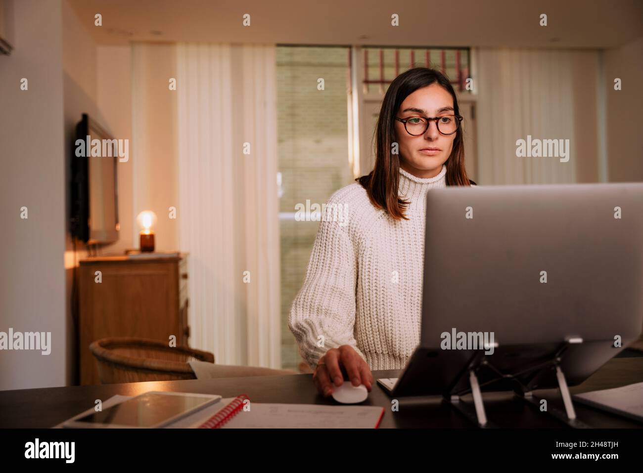 caucasian business women working from home typing on laptop writing ...