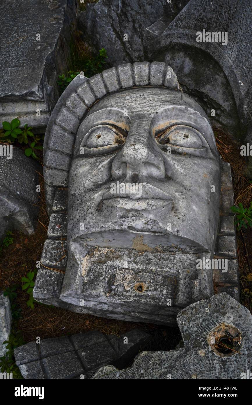 Remains of an ancient broken Greek style stone statue the Head with ...