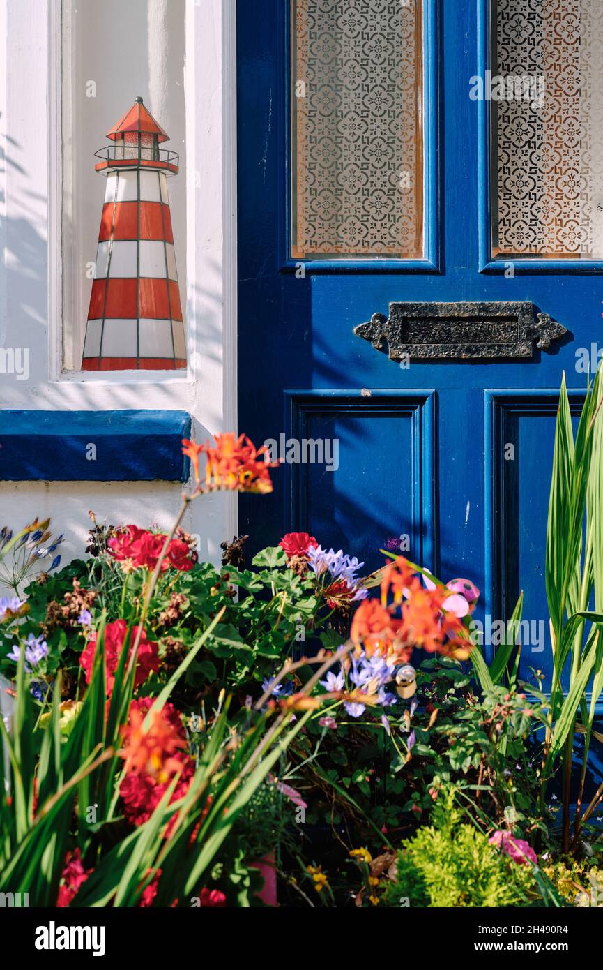 A pretty picturesque lighthouse decorated fisherman's cottage detail in ...