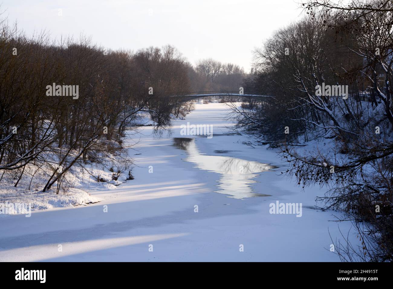 Beautiful winter landscape with a snow-covered river Stock Photo - Alamy