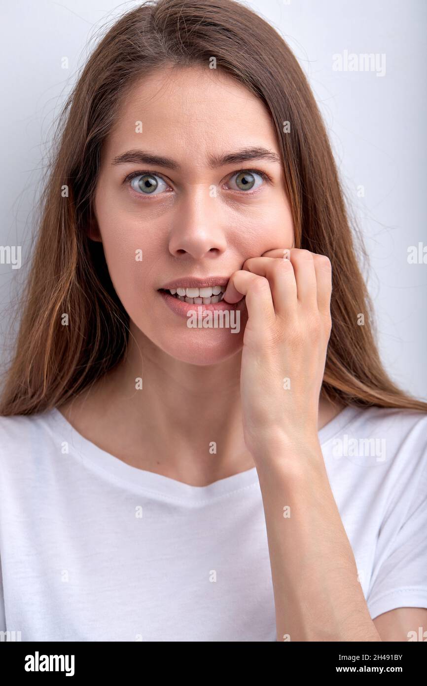 Close-up Portrait of worried surprised caucasian woman keeping hands on ...