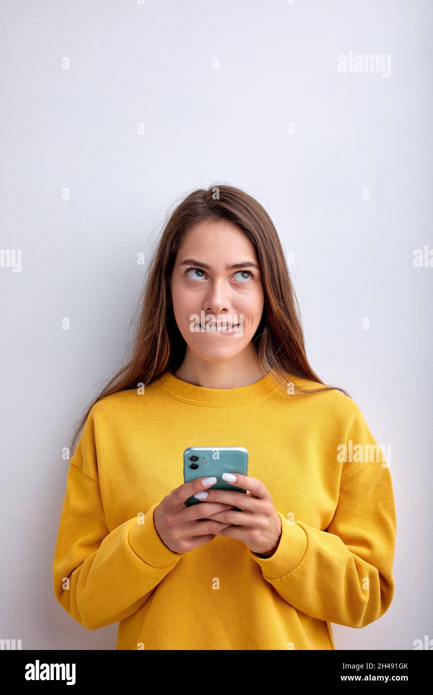 Pretty caucasian woman thinking while chatting with boyfriend, flirting ...