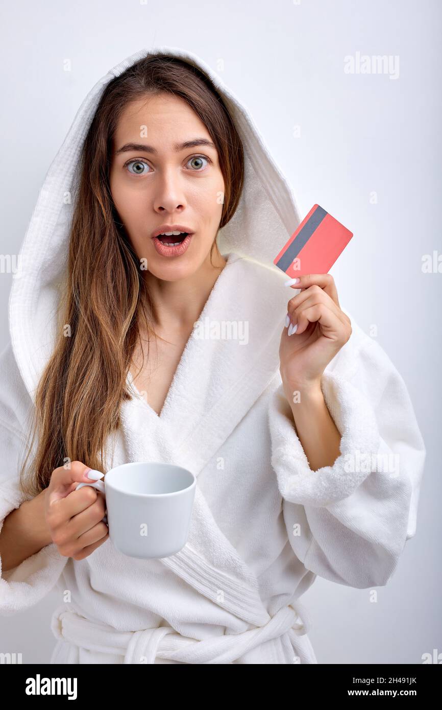 Surprised Shocked Female With Mug And Credit Card In Hands, Look At ...