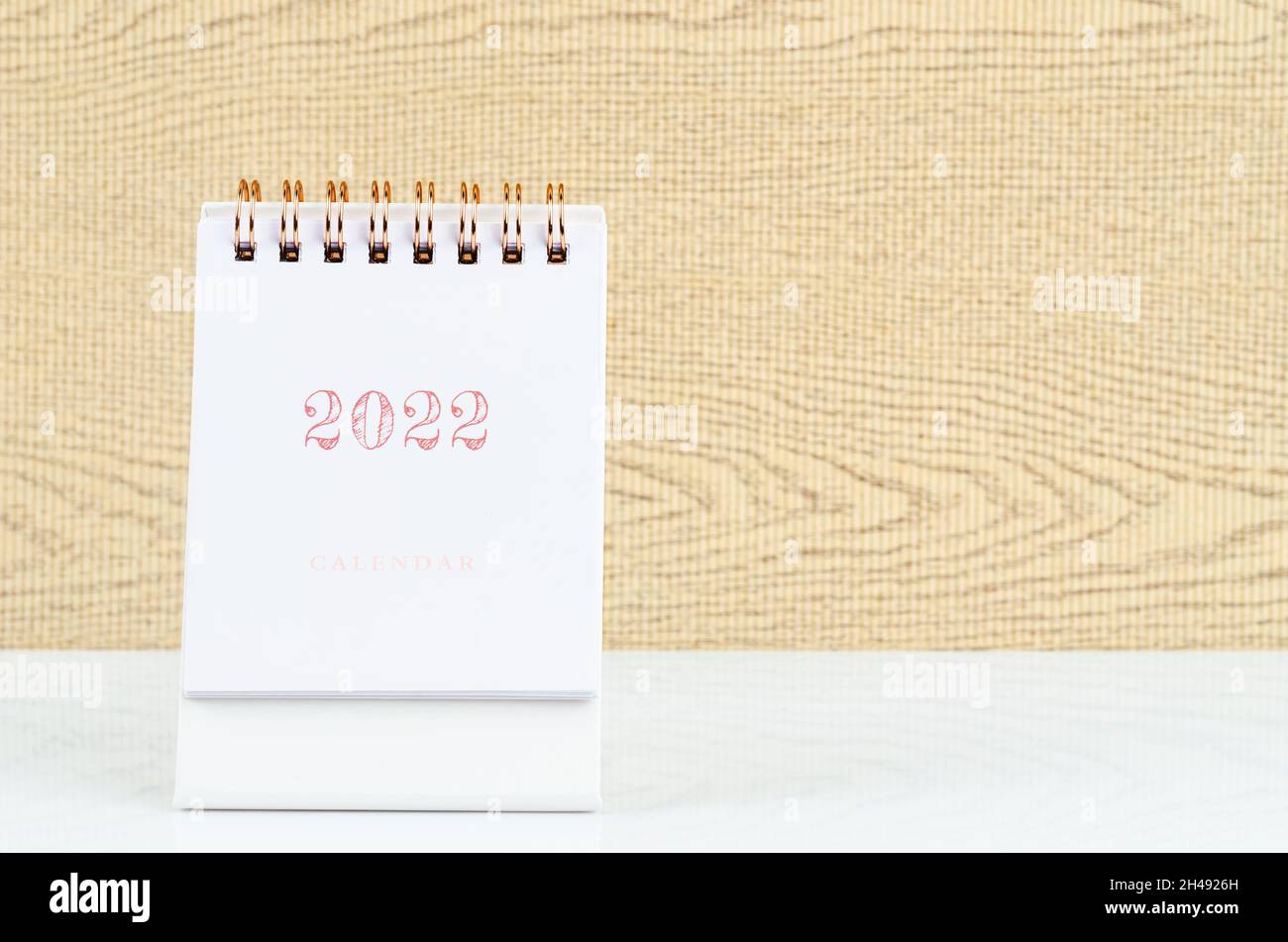 Mini desk calendar 2022 on the white table Stock Photo - Alamy