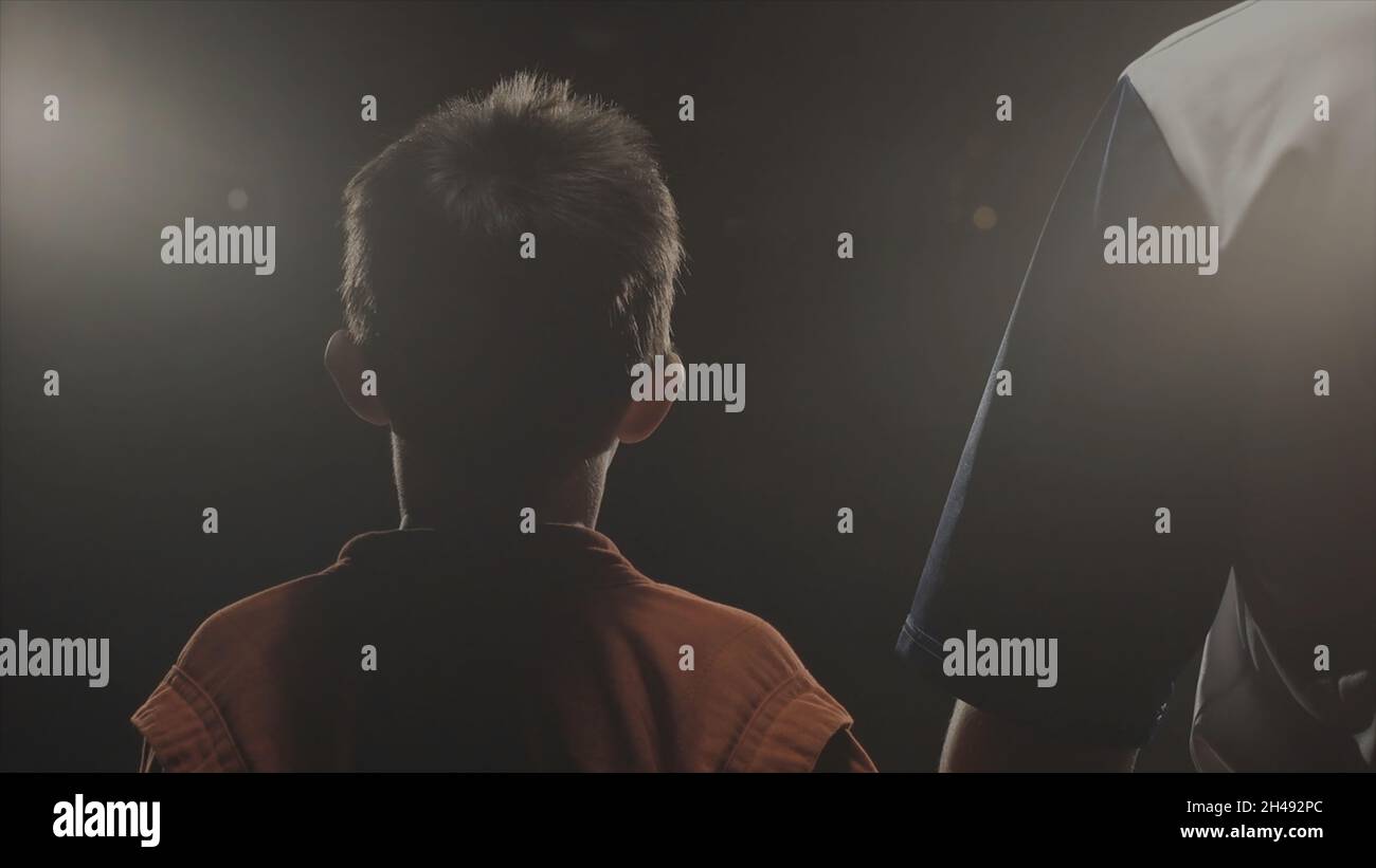 Rear view of the referee who raises the winner's hand. The referee ...