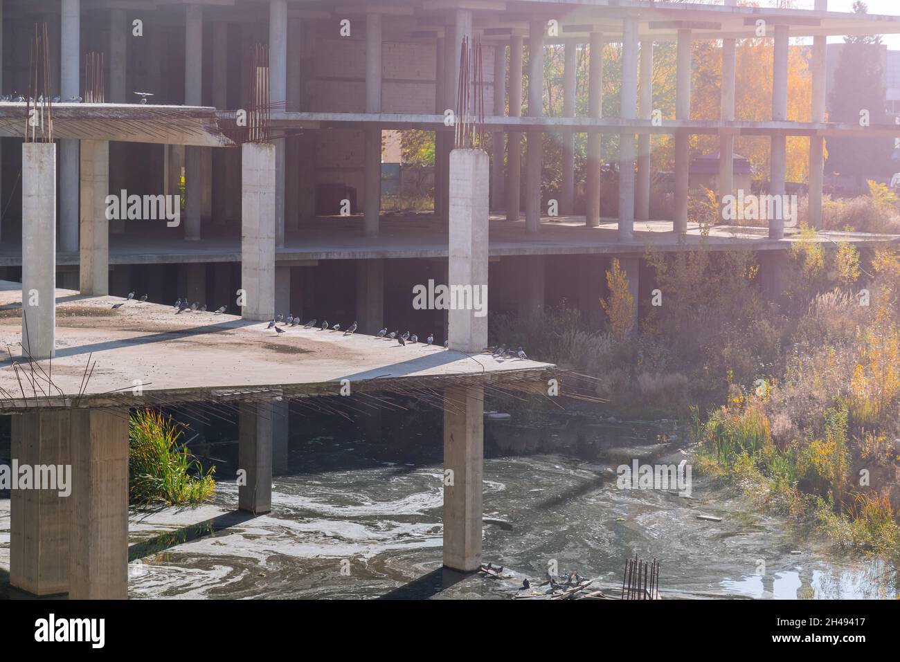 Construction site with flooded foundations and piles after a hurricane ...