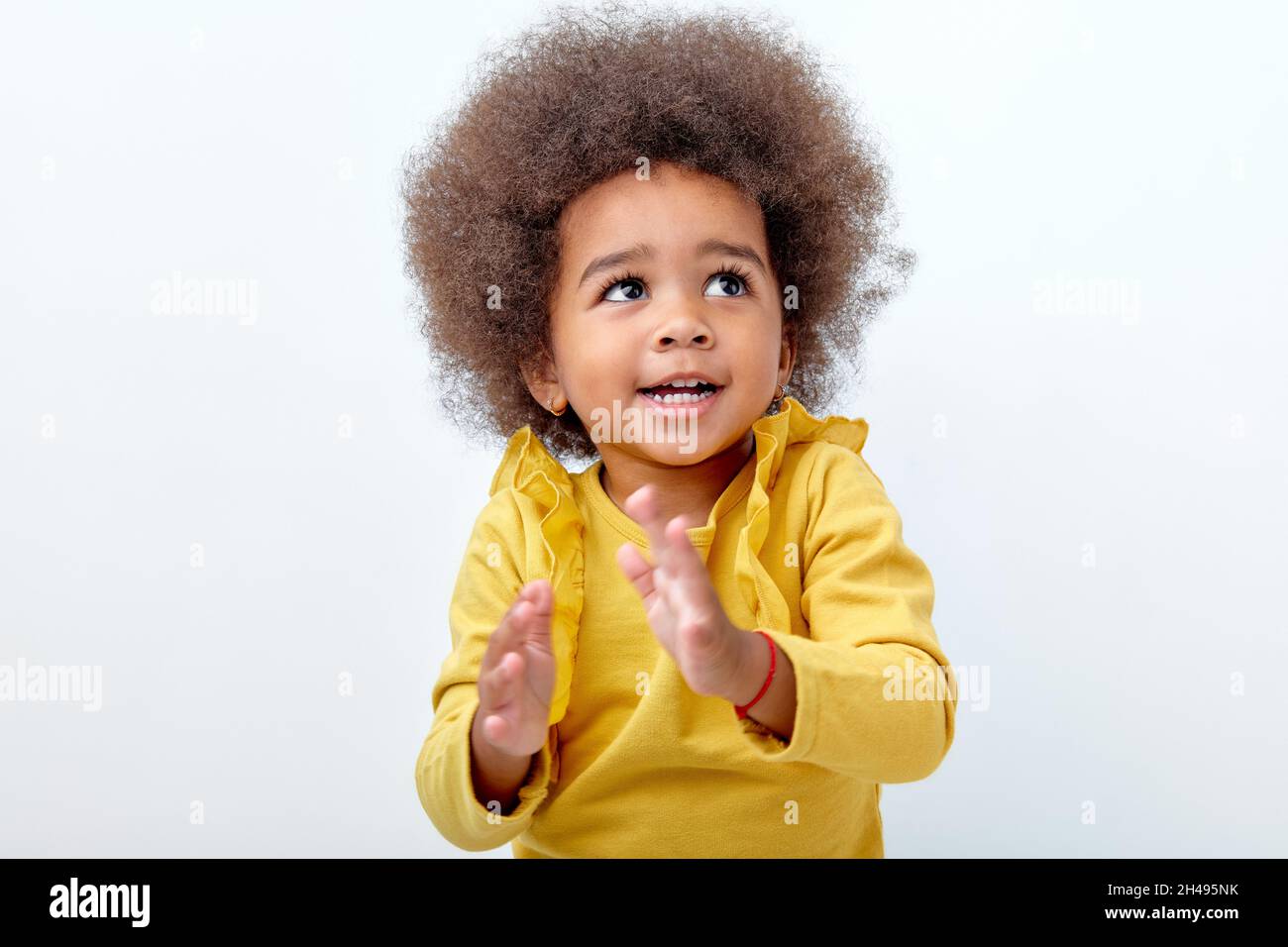 Afro fluffy child girl clapping and applauding, happy and joyful ...