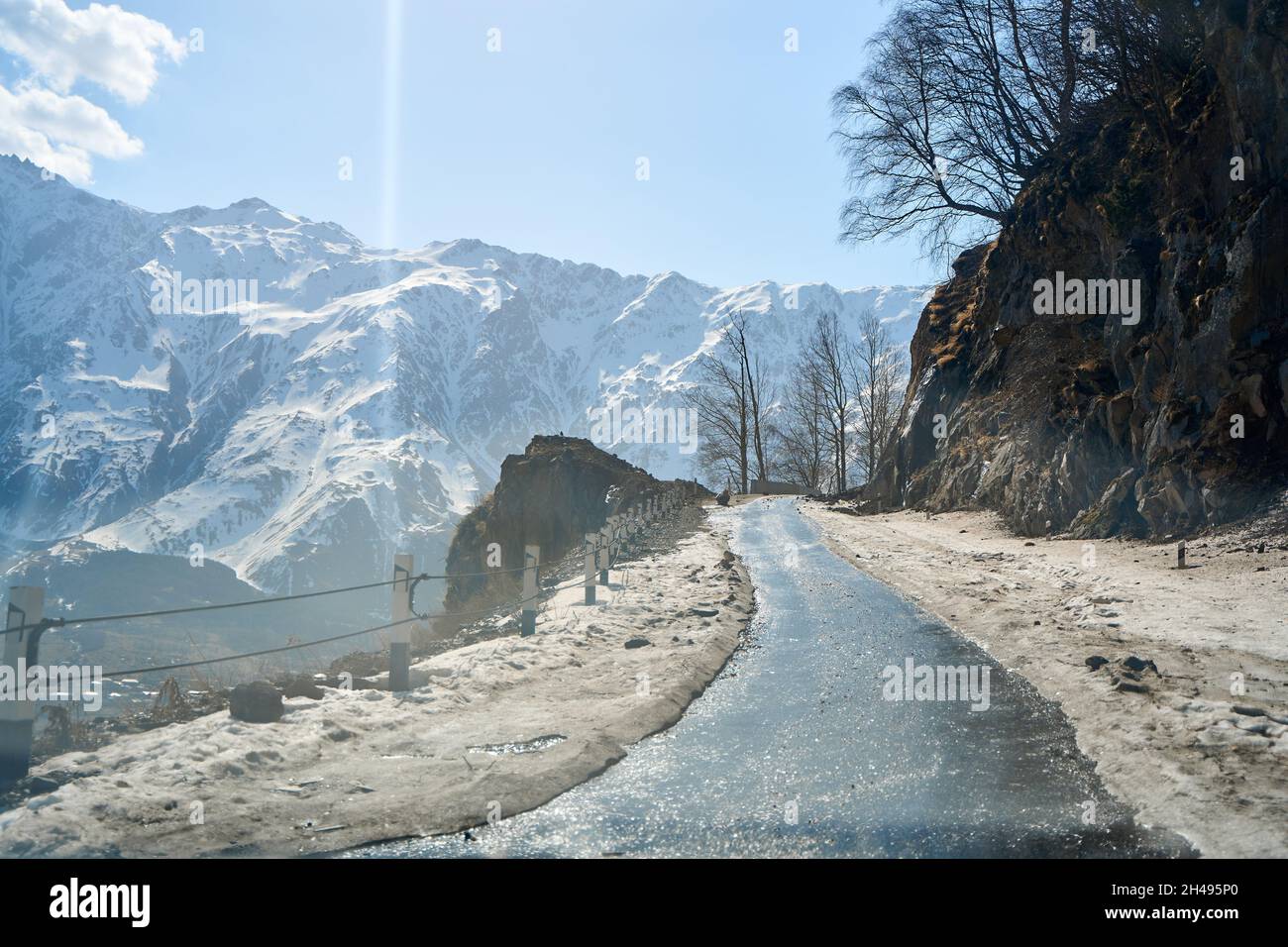 Dangerous winding road among the mountains. Mountain streamer in early ...
