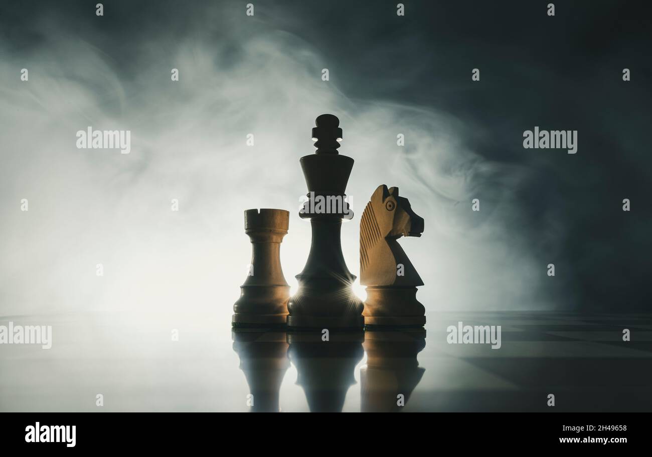 Chess pieces on the chessboard with smoke: challenge and competition ...