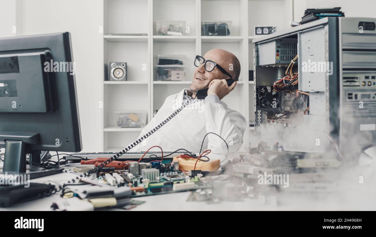 Computer engineer working on broken hi-res stock photography and images ...