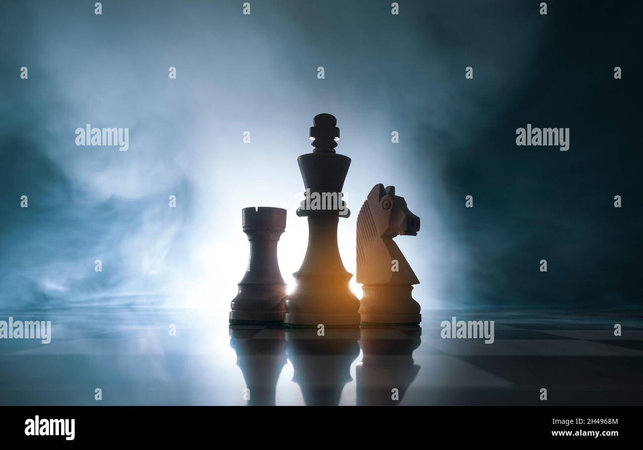 Chess pieces on the chessboard with smoke: challenge and competition ...
