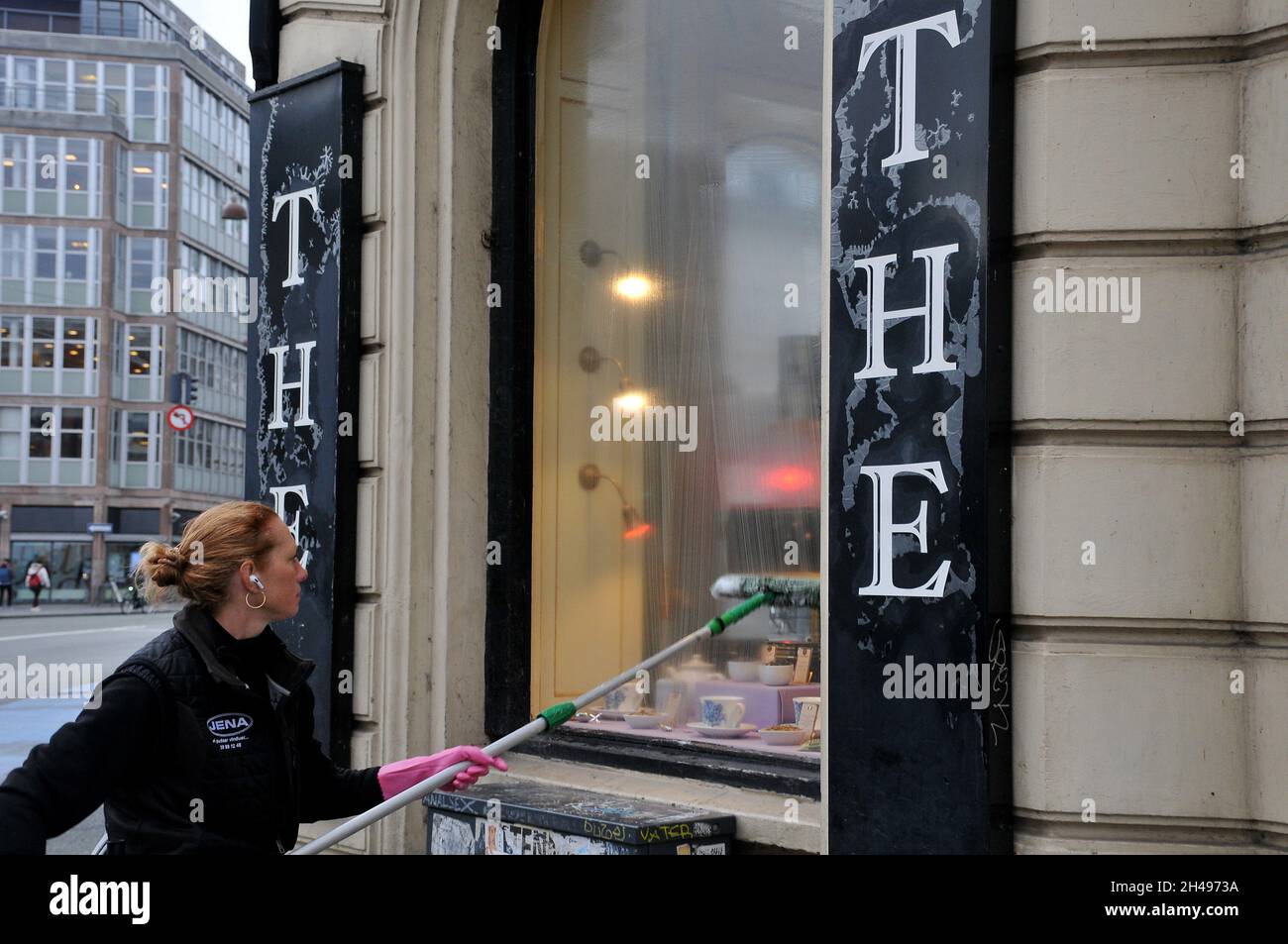 Copenhagen /Denmark / 01 November 2021 / Female window cleaner in ...