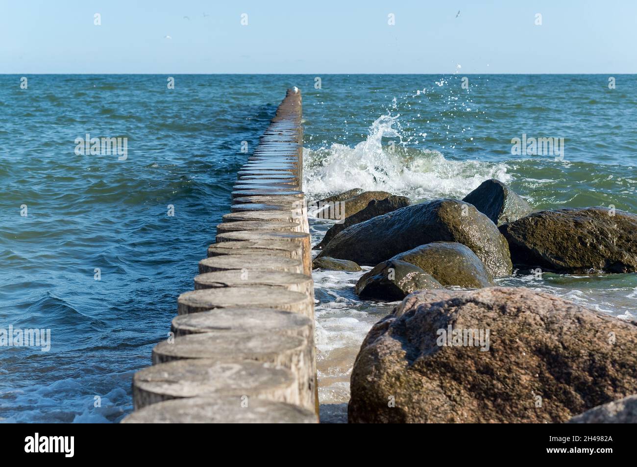 Waves and a storm at sea. Waves crashing on breakwaters. Sea wave ...