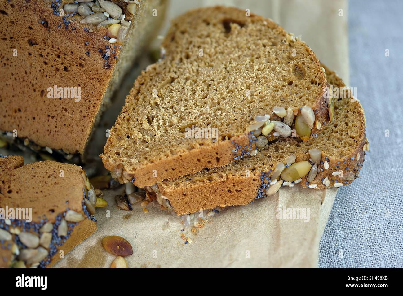 Cereal bread on a tablecloth close-up. Yeast-free bread made with rye ...