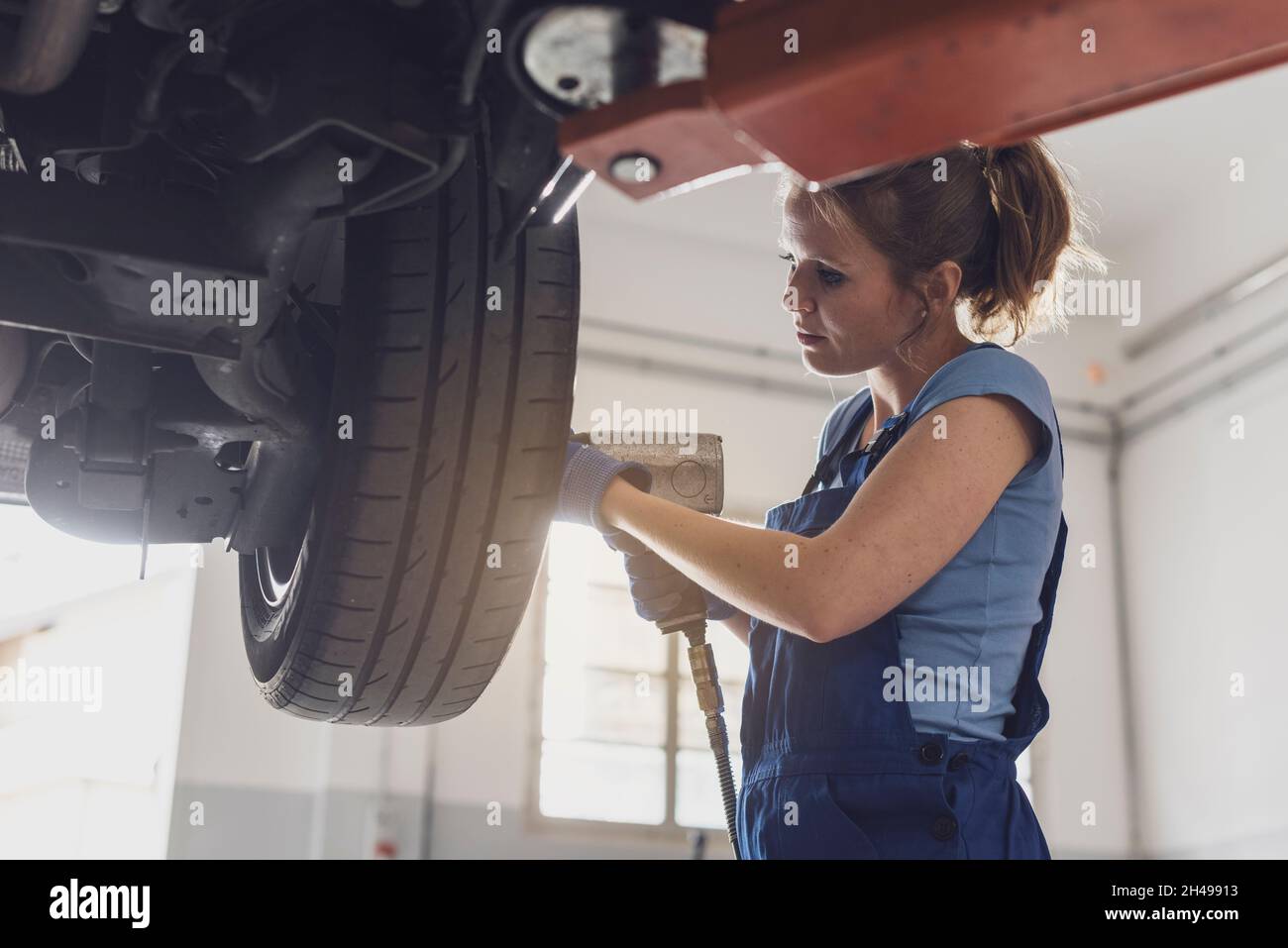 Checking tyres at service station hi-res stock photography and images ...