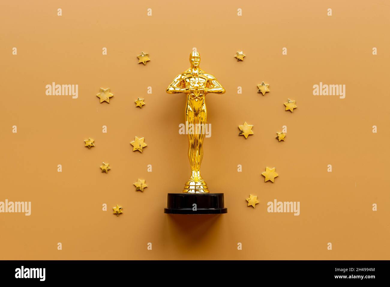Golden movie award statue with stars - best film winner Stock Photo - Alamy