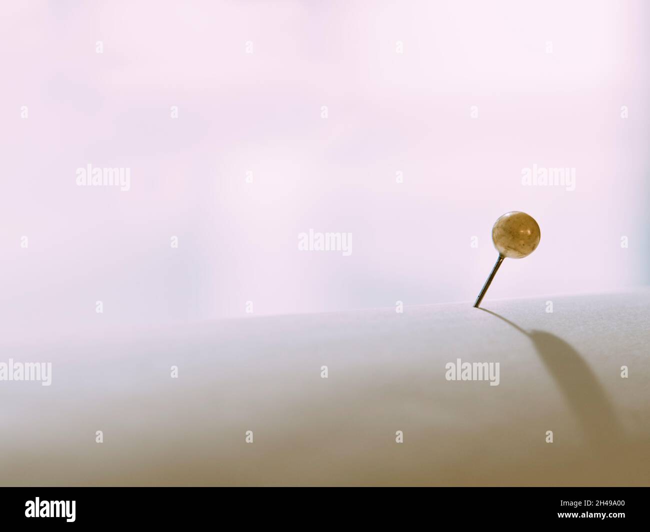 Bobby pin on roll of white paper against white background Stock Photo ...