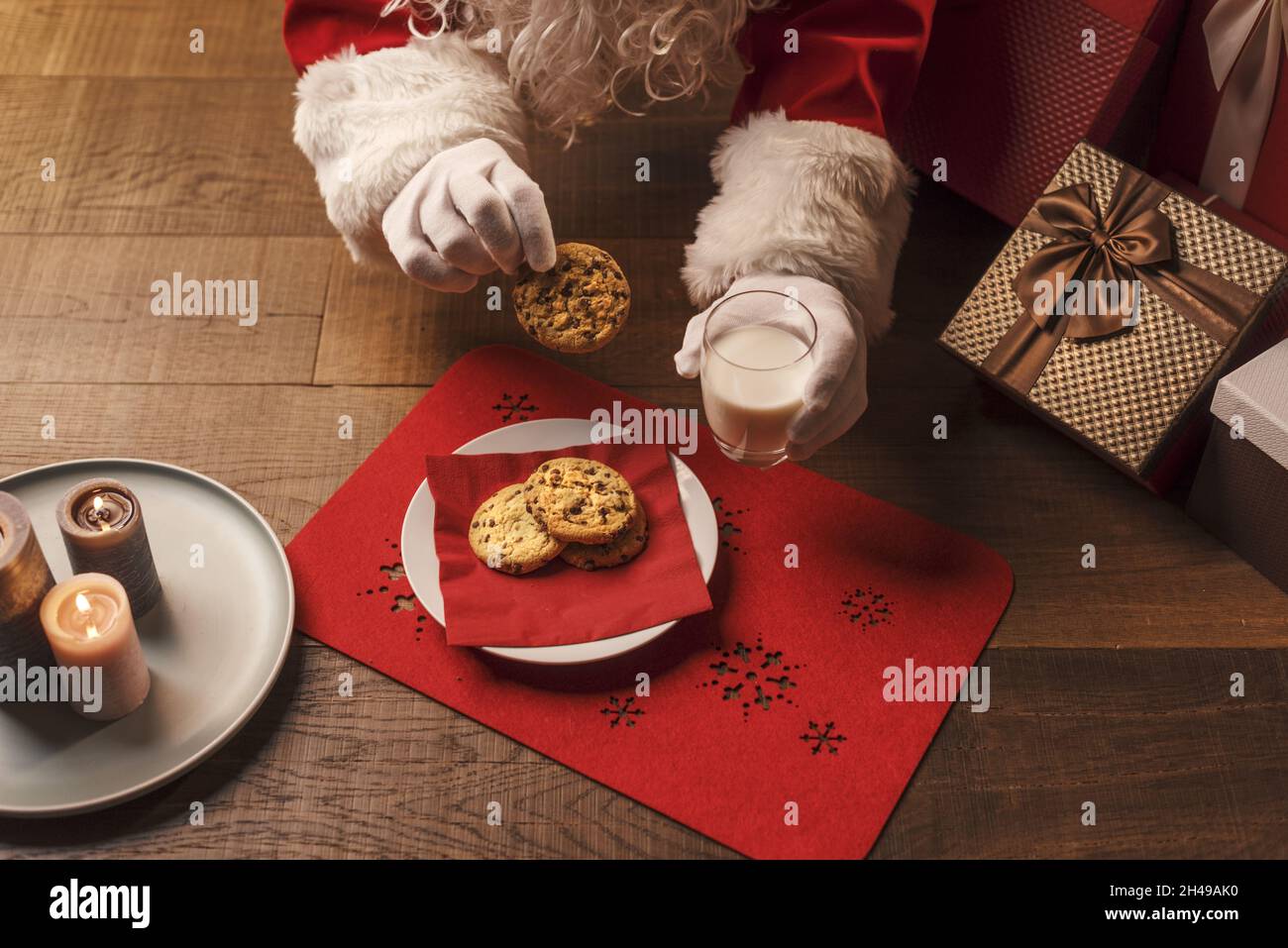 Santa eating cookies hi-res stock photography and images - Alamy