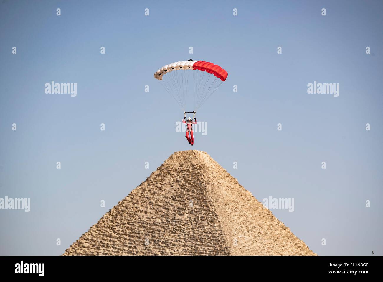 Giza, Egypt. 01st Nov, 2021. A professional skydiver flies over the ...