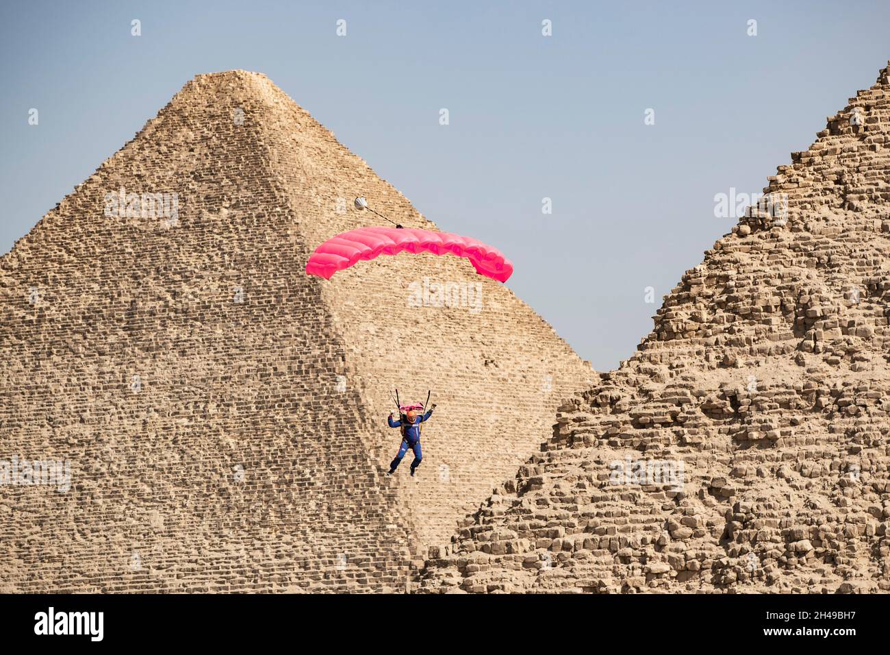 Giza, Egypt. 01st Nov, 2021. A professional skydiver lands near the ...