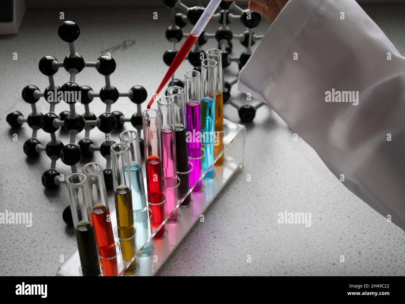 Science test tubes being used Stock Photo - Alamy