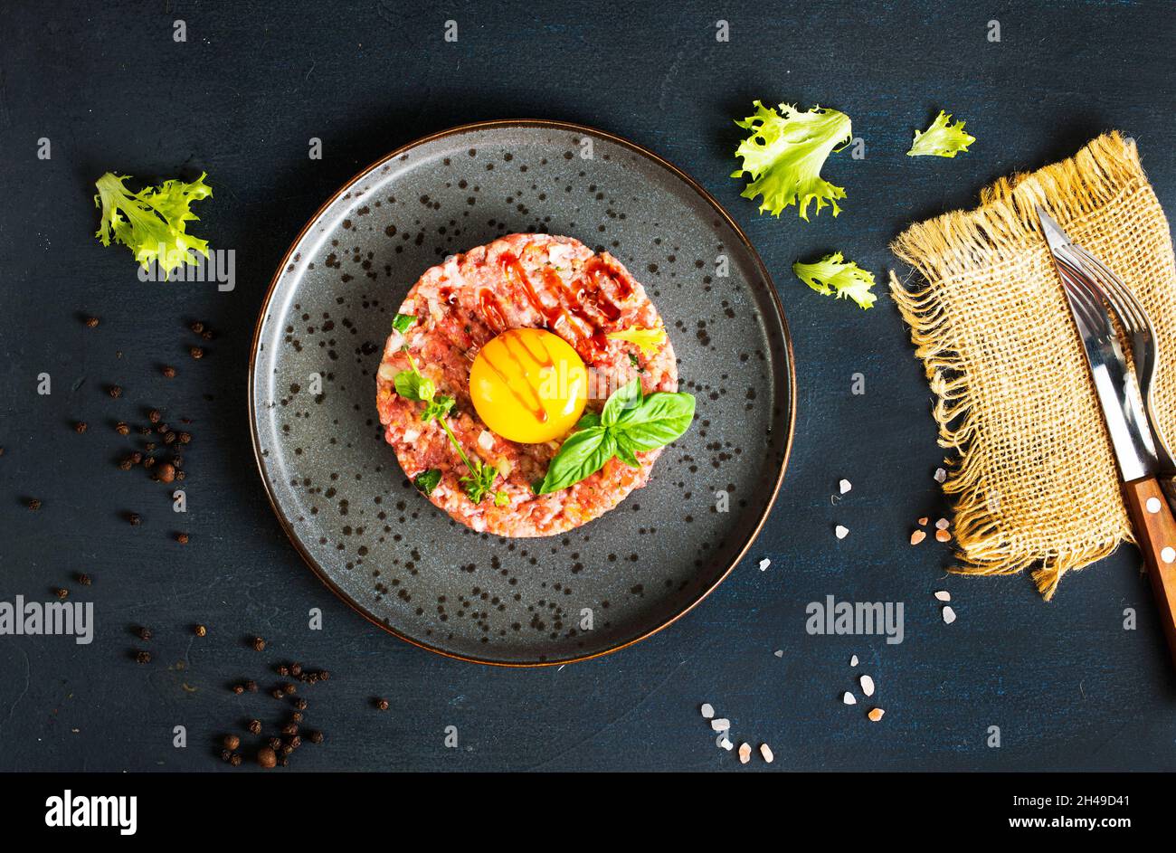 tar-tar from beef with raw yolk on plate Stock Photo - Alamy