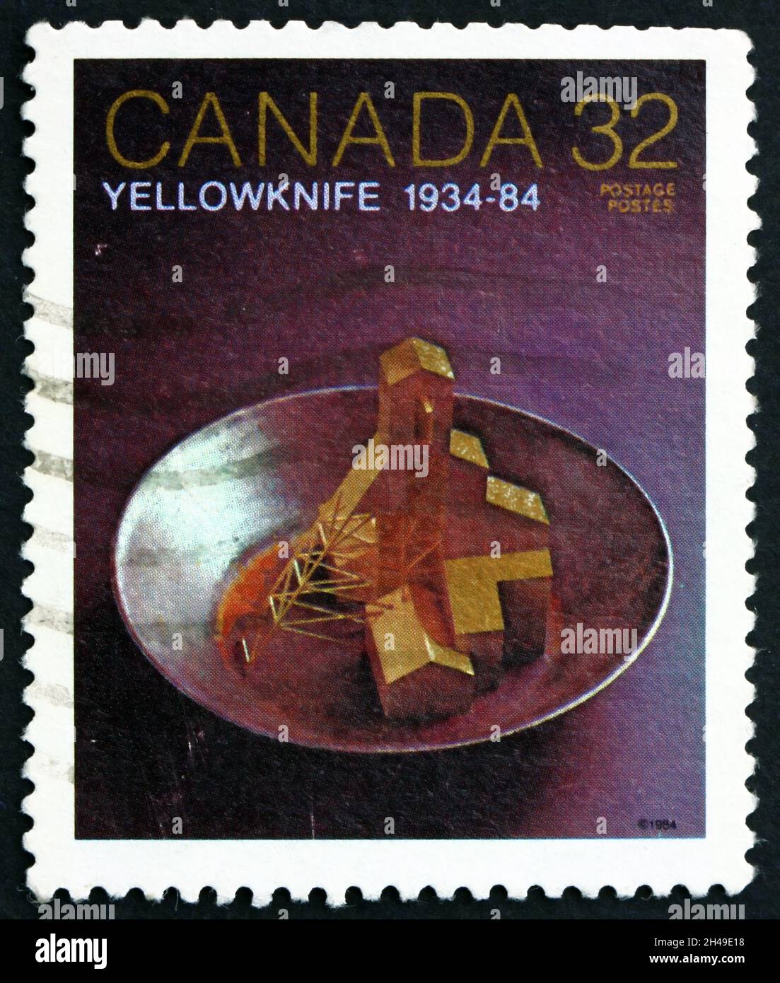 CANADA - CIRCA 1984: a stamp printed in Canada shows Yellowknife, gold ...
