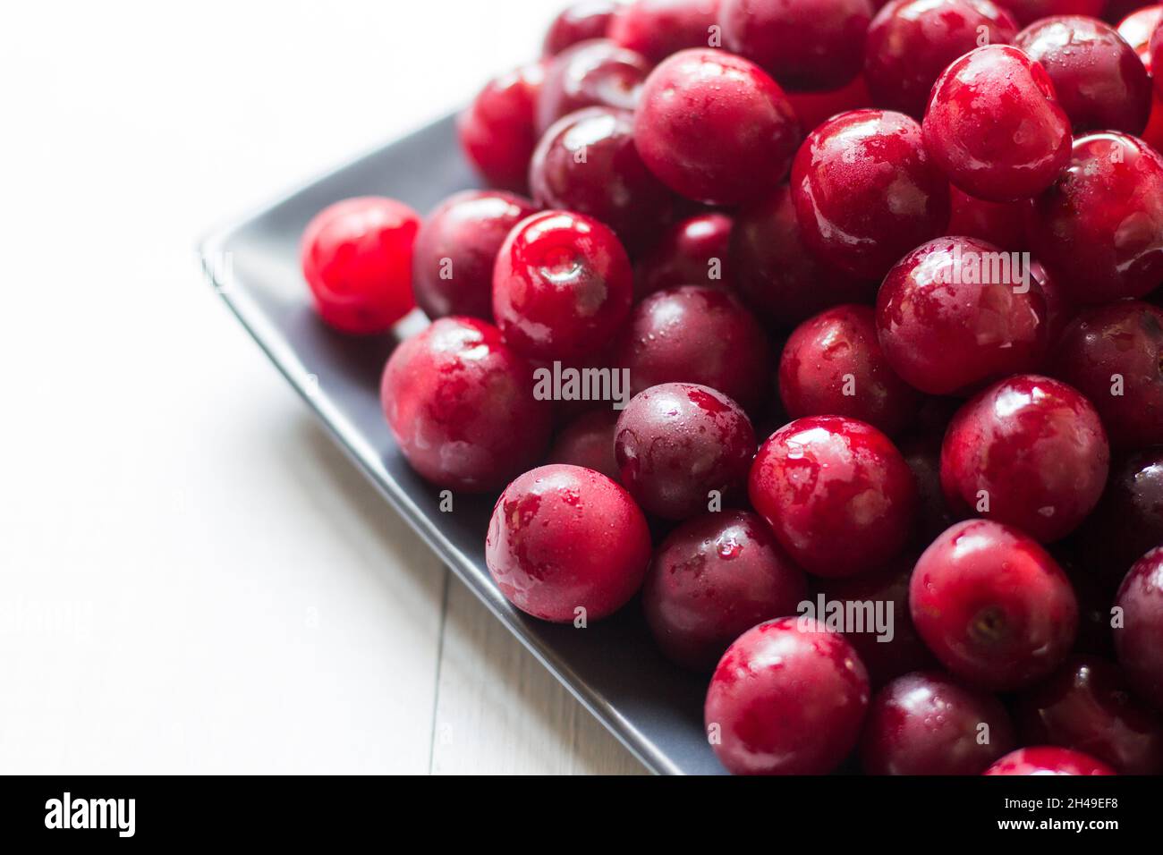 fresh cherry fruits on plate Stock Photo - Alamy
