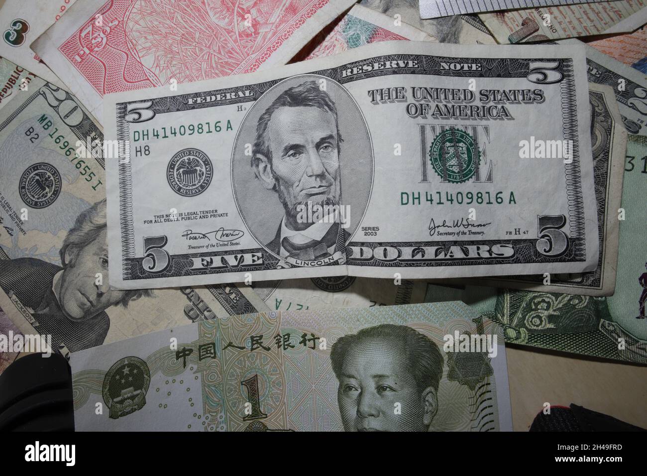 International banknotes over table with Dolar banknote on the top Stock ...