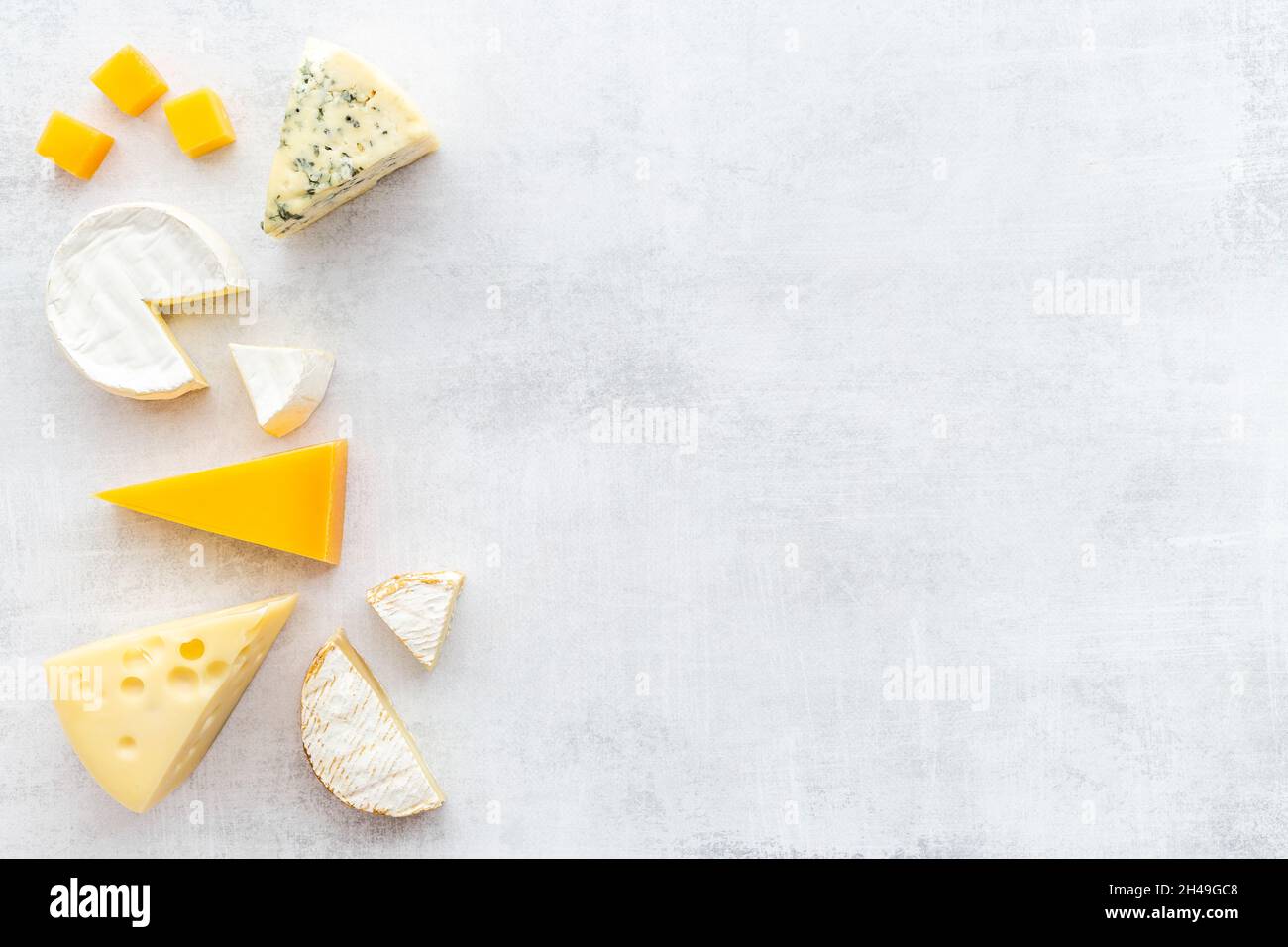 Various types of cheese layout. Dairy products flat lay Stock Photo - Alamy