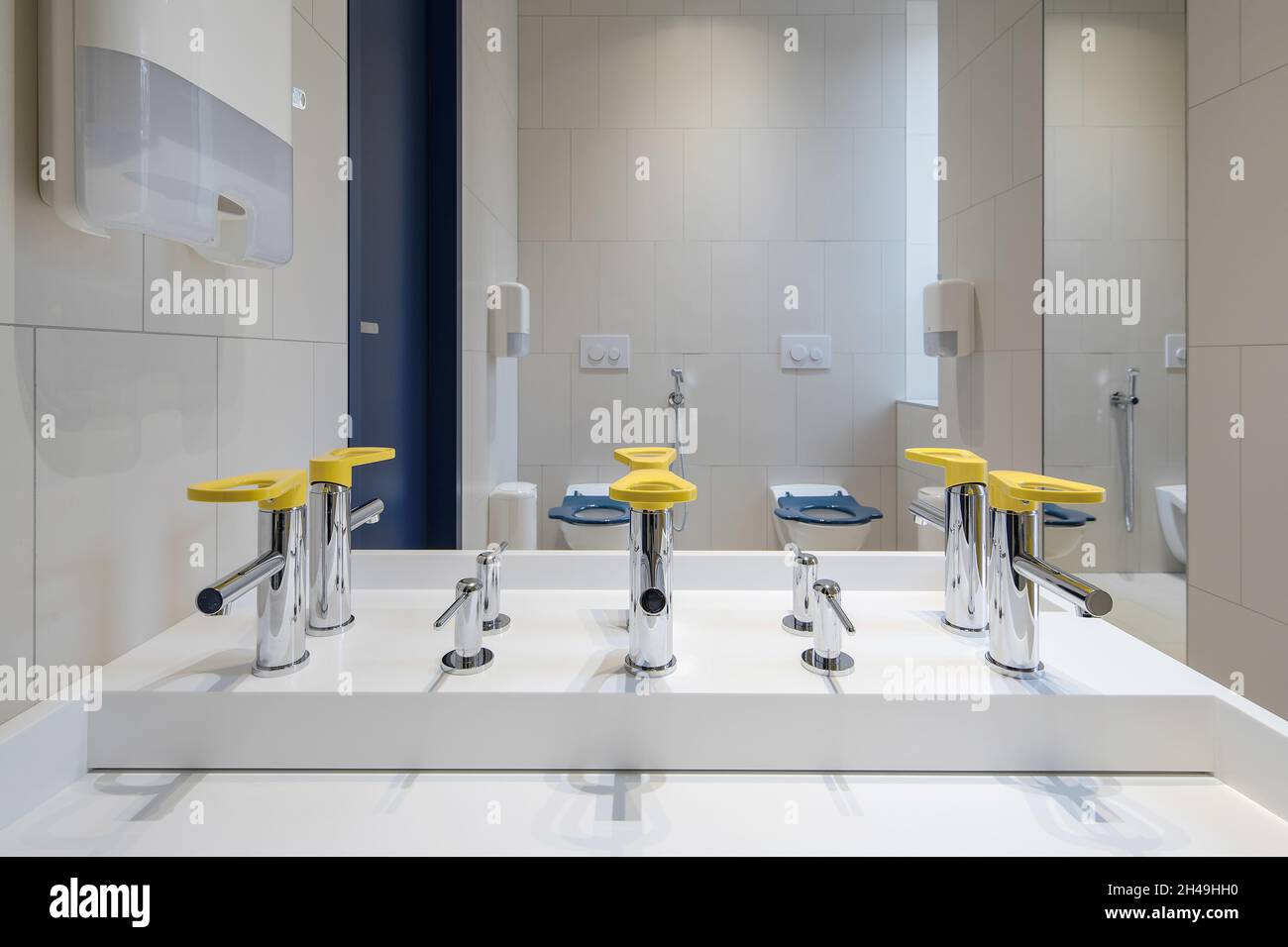 Modern public restroom for children minimal interior yellow and blue ...