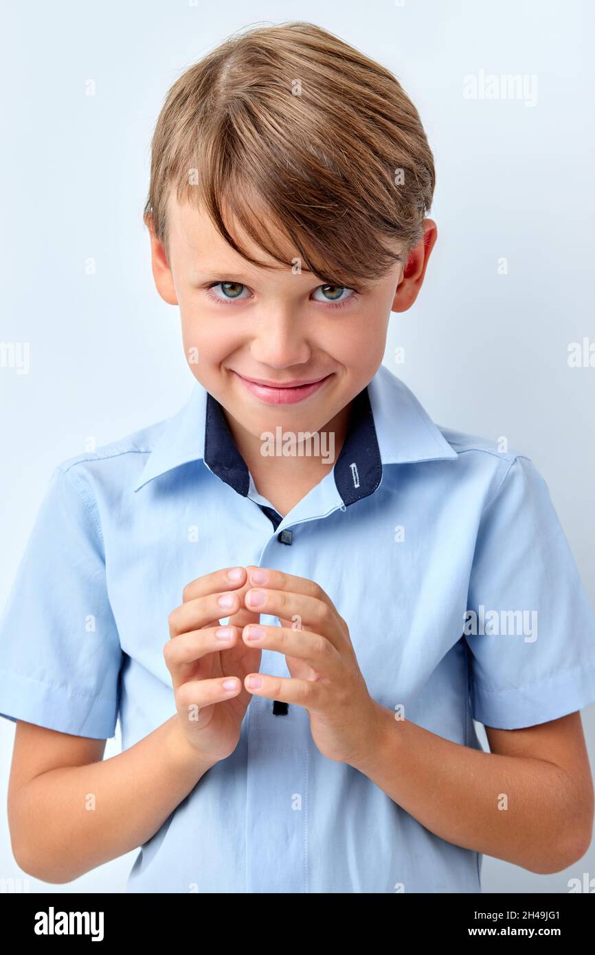 young little kid look in camera planning joke wearing shirt, isolated ...