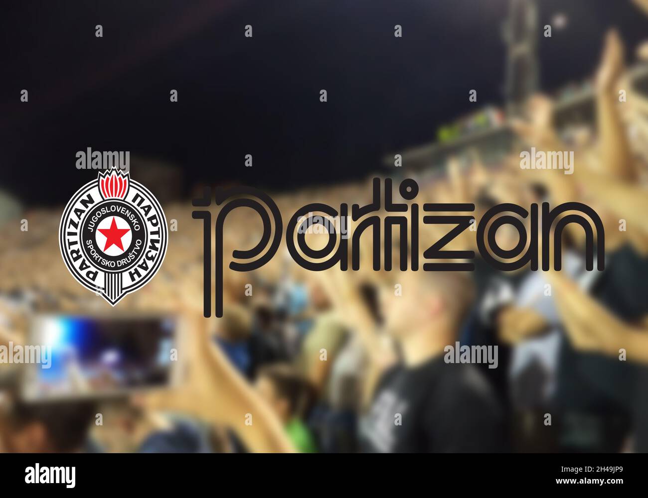 The coat of arms of FC Partizan, Belgrade, Serbia, in the background a ...