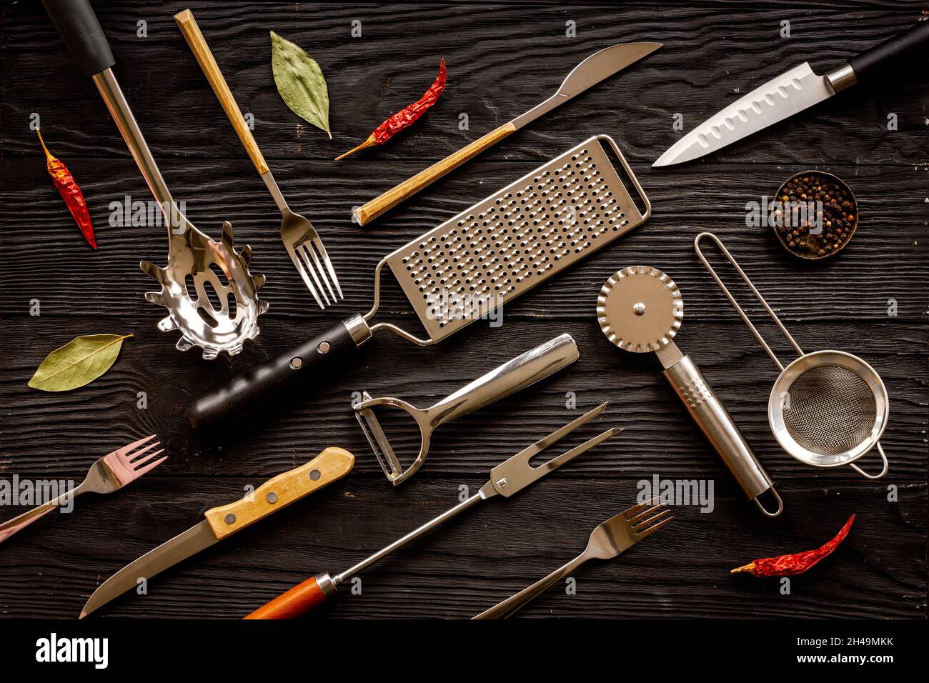 Cooking background with metal kitchen utensils and cookware Stock Photo ...