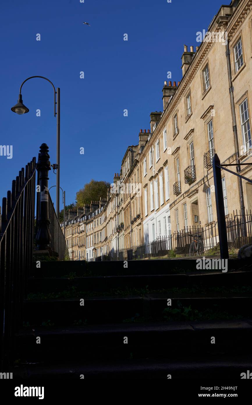 Sunlit terrace of Georgian buildings in Walcot Parade in the historic ...