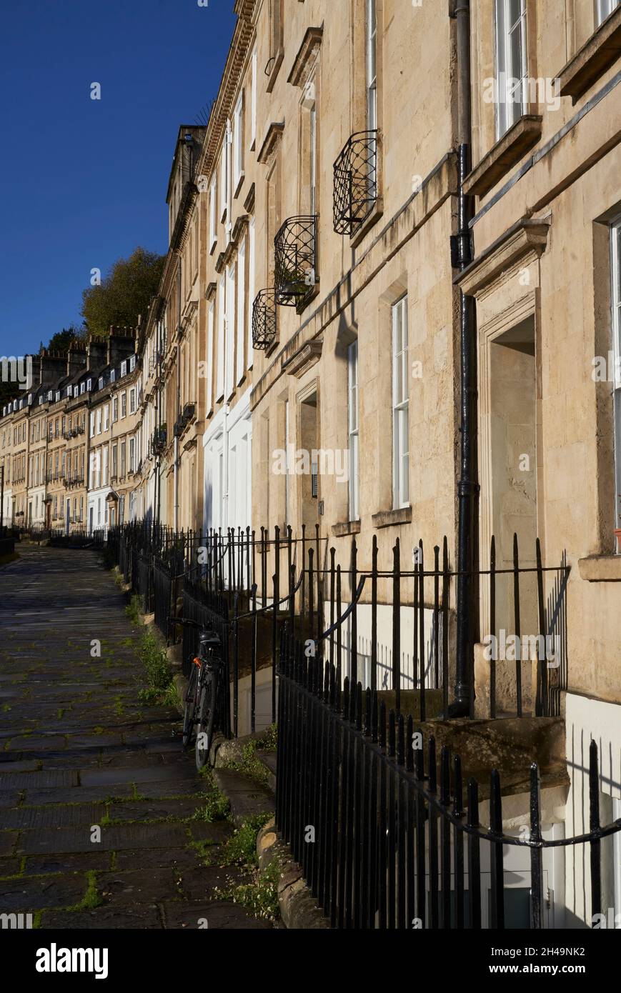 Sunlit terrace of Georgian buildings in Walcot Parade in the historic ...