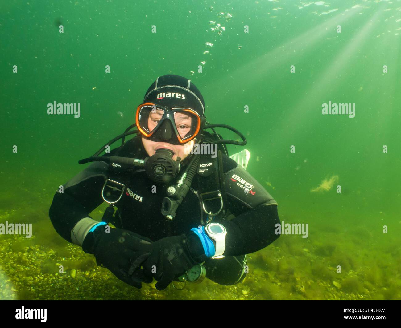September 5, 2021 - Malmo, Sweden: A female scuba diver lit up by rays ...