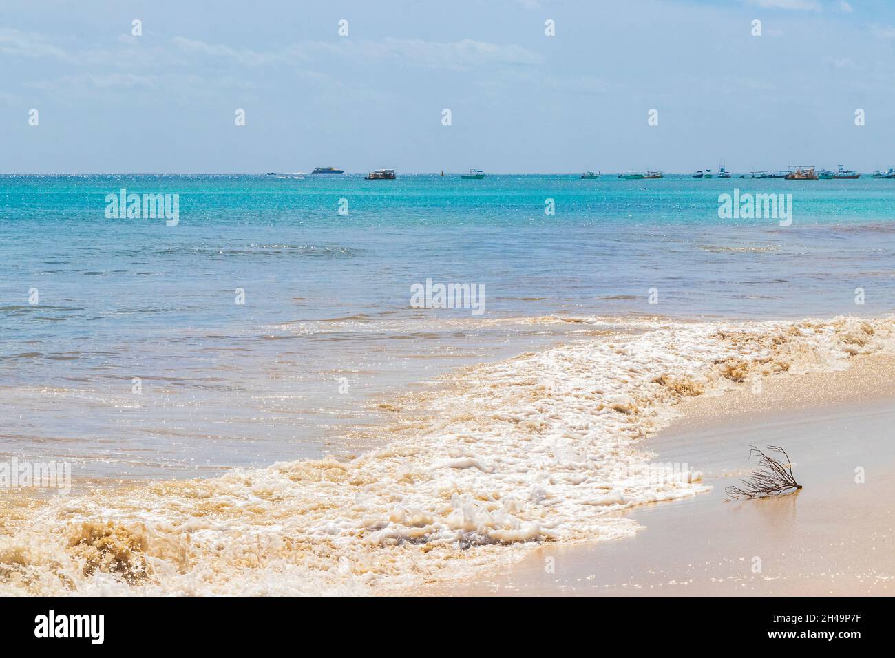 Tropical mexican beach with strong waves and clear turquoise blue water ...
