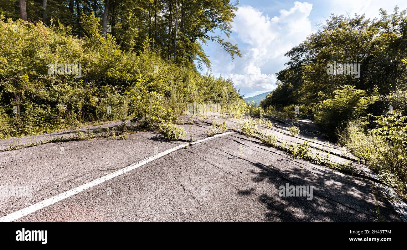 Swollen asphalt. Destroyed road consequences of a natural cataclysm of ...