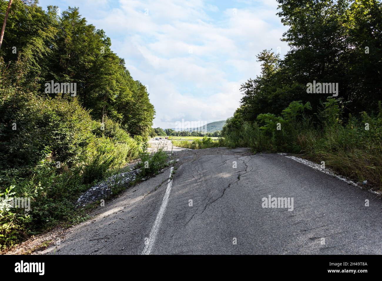 Swollen asphalt. Destroyed road consequences of a natural cataclysm of ...